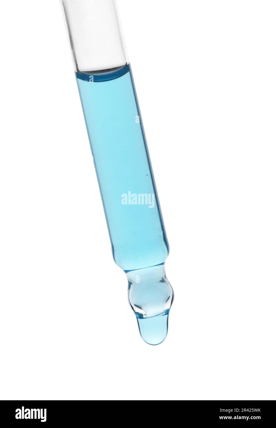 Dripping light blue facial serum from pipette on white background ...