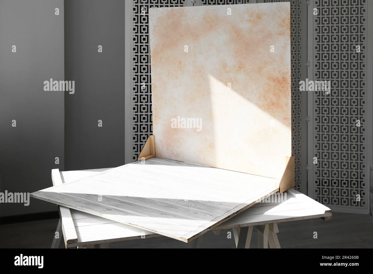 Double-sided backdrop on table in photo studio Stock Photo - Alamy