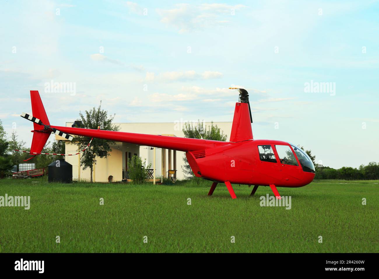 Red helicopter on green background hi-res stock photography and images ...
