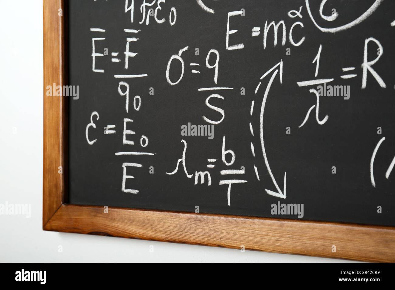 Blackboard with different physical formulas written with chalk on white ...
