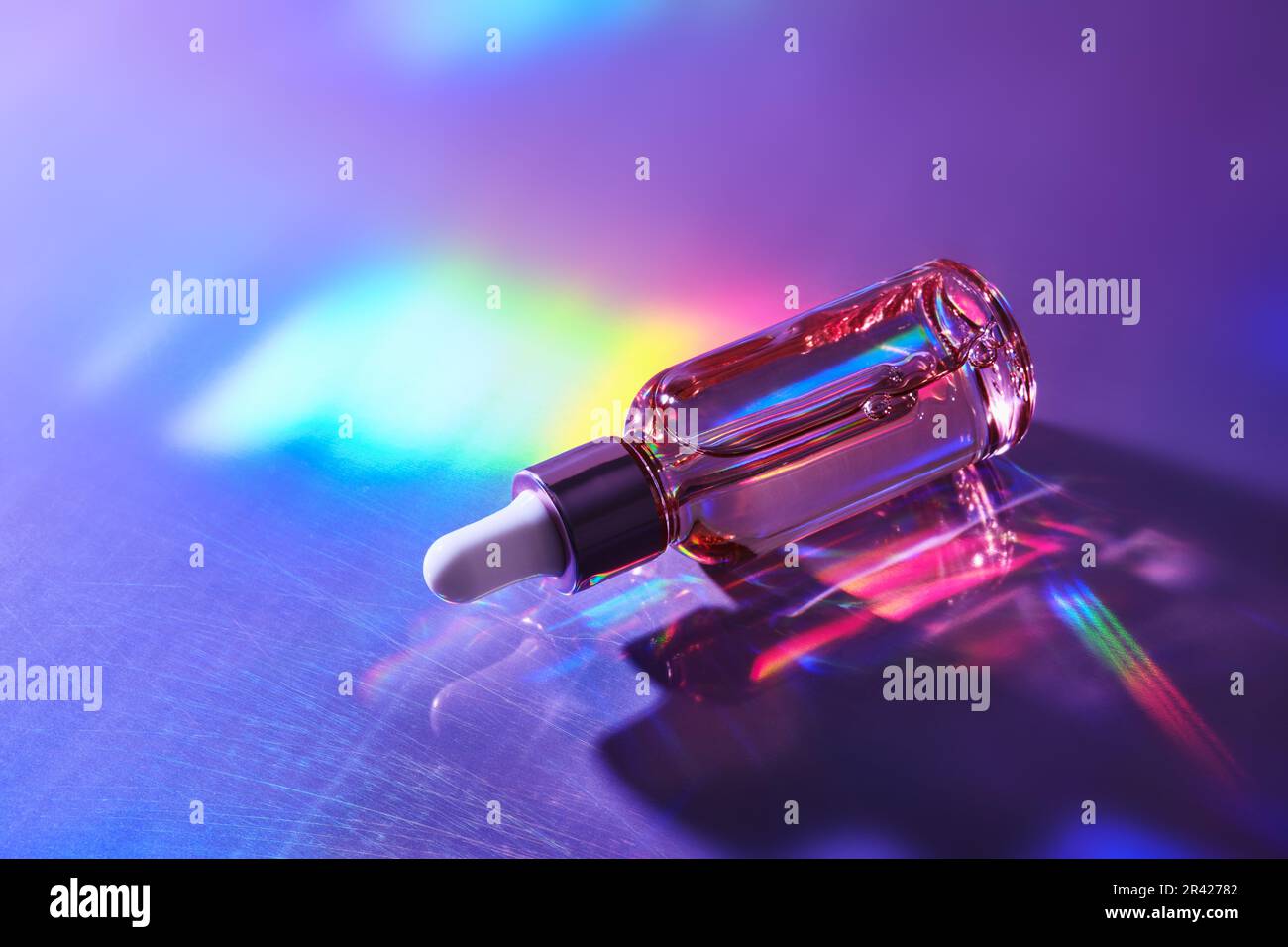 Cosmetic product bottle with iridescent highlights on holographic ...