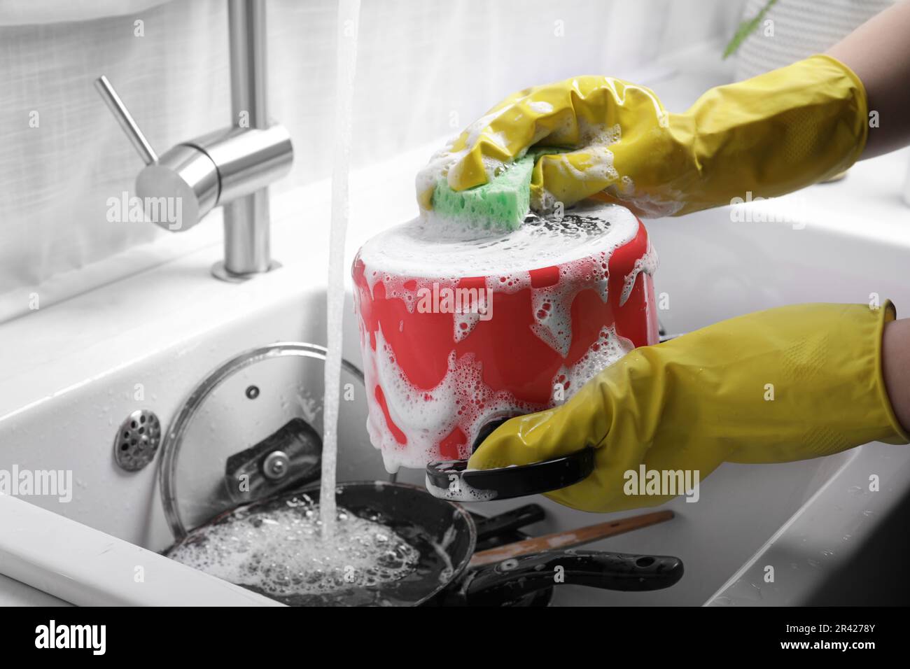 Woman cooking pot cleaning hi-res stock photography and images - Alamy