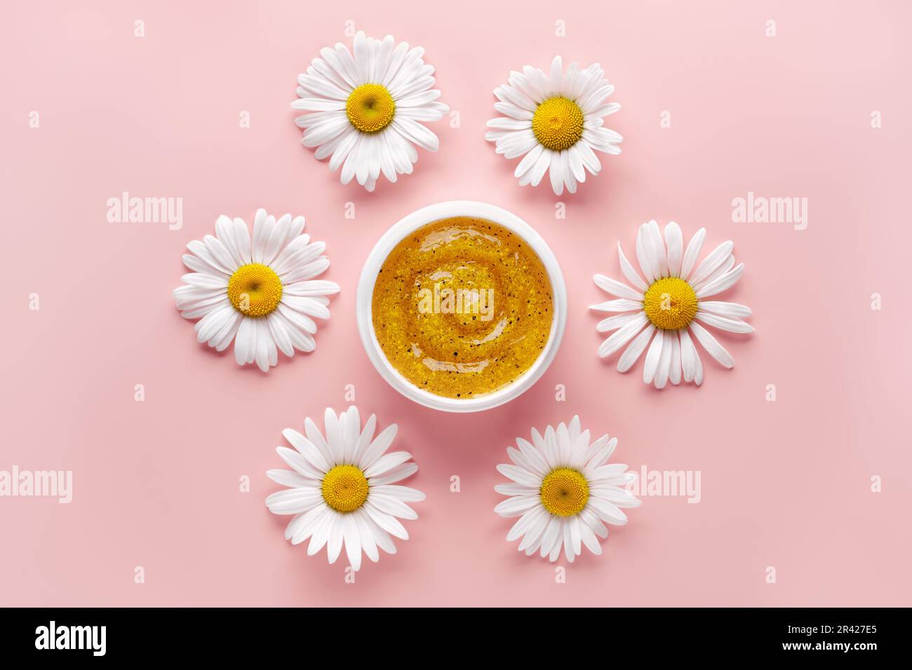 Gel cosmetic product with particles in petri dish on pink background ...