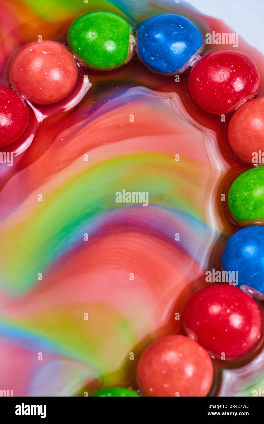 Skittles Candy Ring Bleeding Colors Close-Up Stock Photo - Alamy