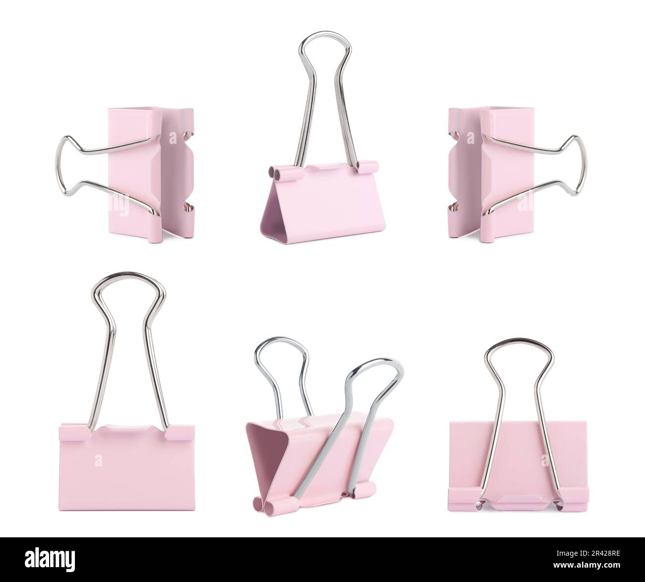 Set with pink binder clips on white background Stock Photo - Alamy