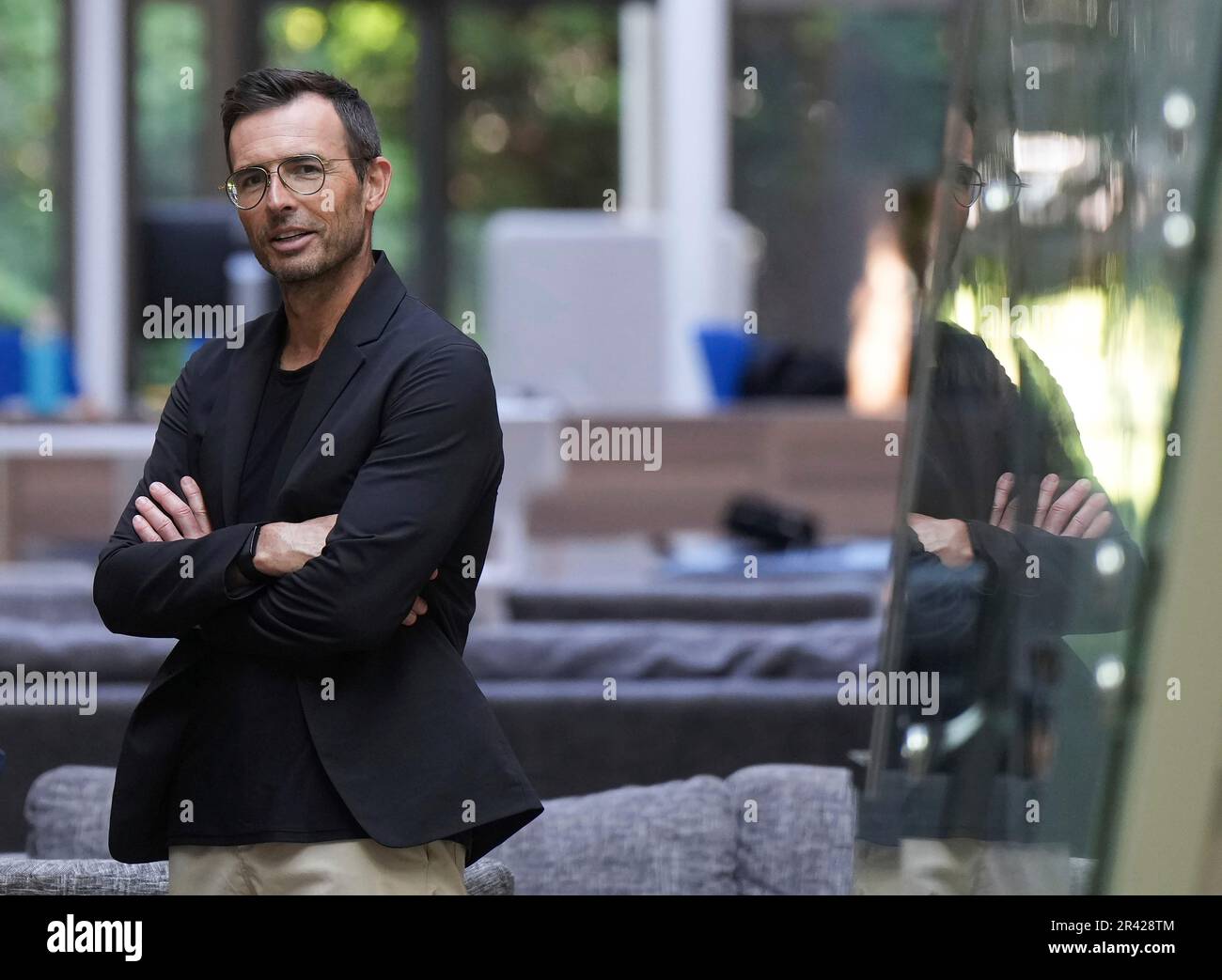 Lululemon CEO Calvin McDonald poses after speaking at a news conference ...