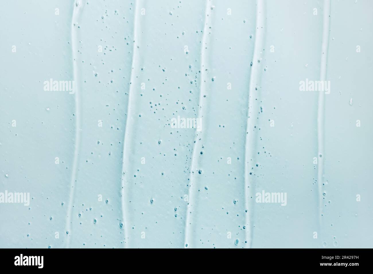 Liquid gel abstract cosmetic blue background. Smear of transparent ...