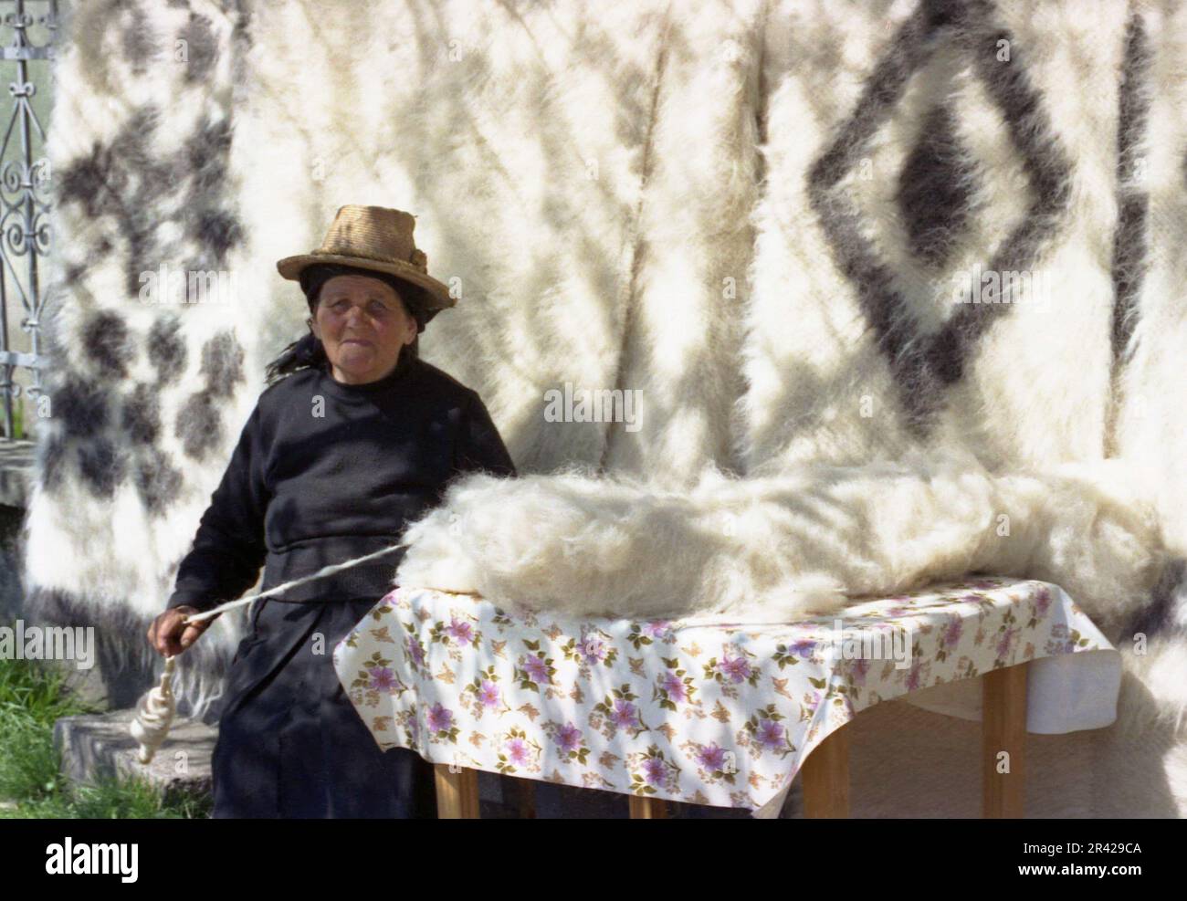 Maramures County, Romania, 2001. Local woman making and selling ...