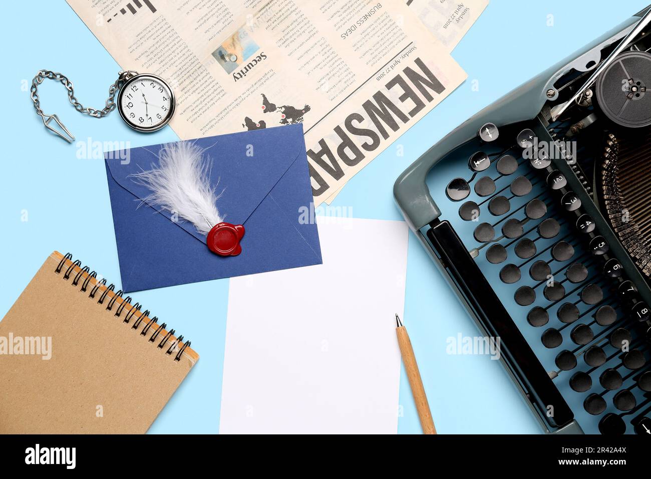 Composition with vintage typewriter, envelope, pocket watch and paper ...