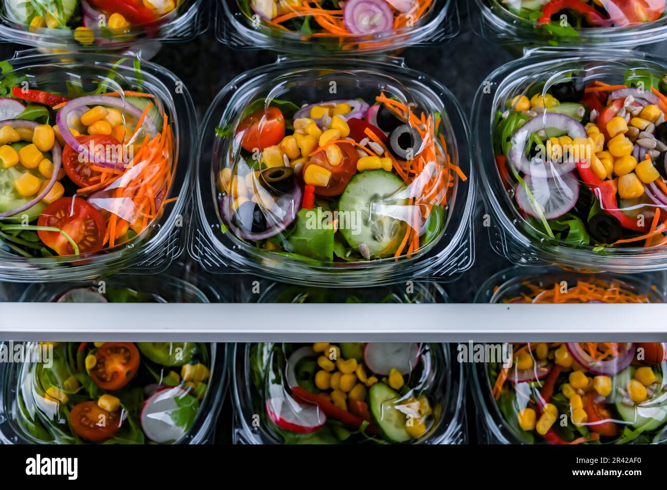 Plastic boxes with pre-packaged vegetable salads Stock Photo - Alamy