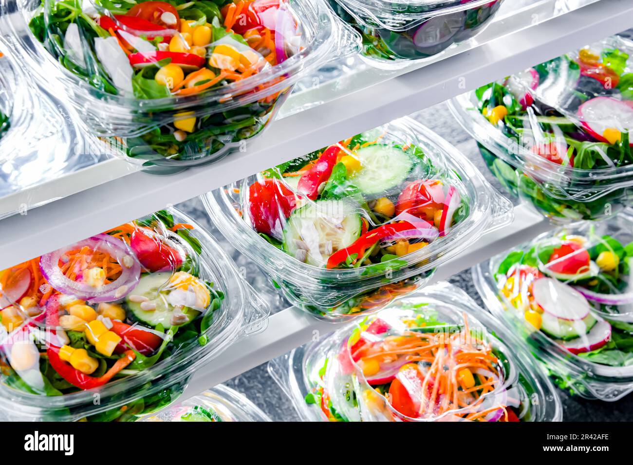 Plastic boxes with pre-packaged vegetable salads Stock Photo - Alamy