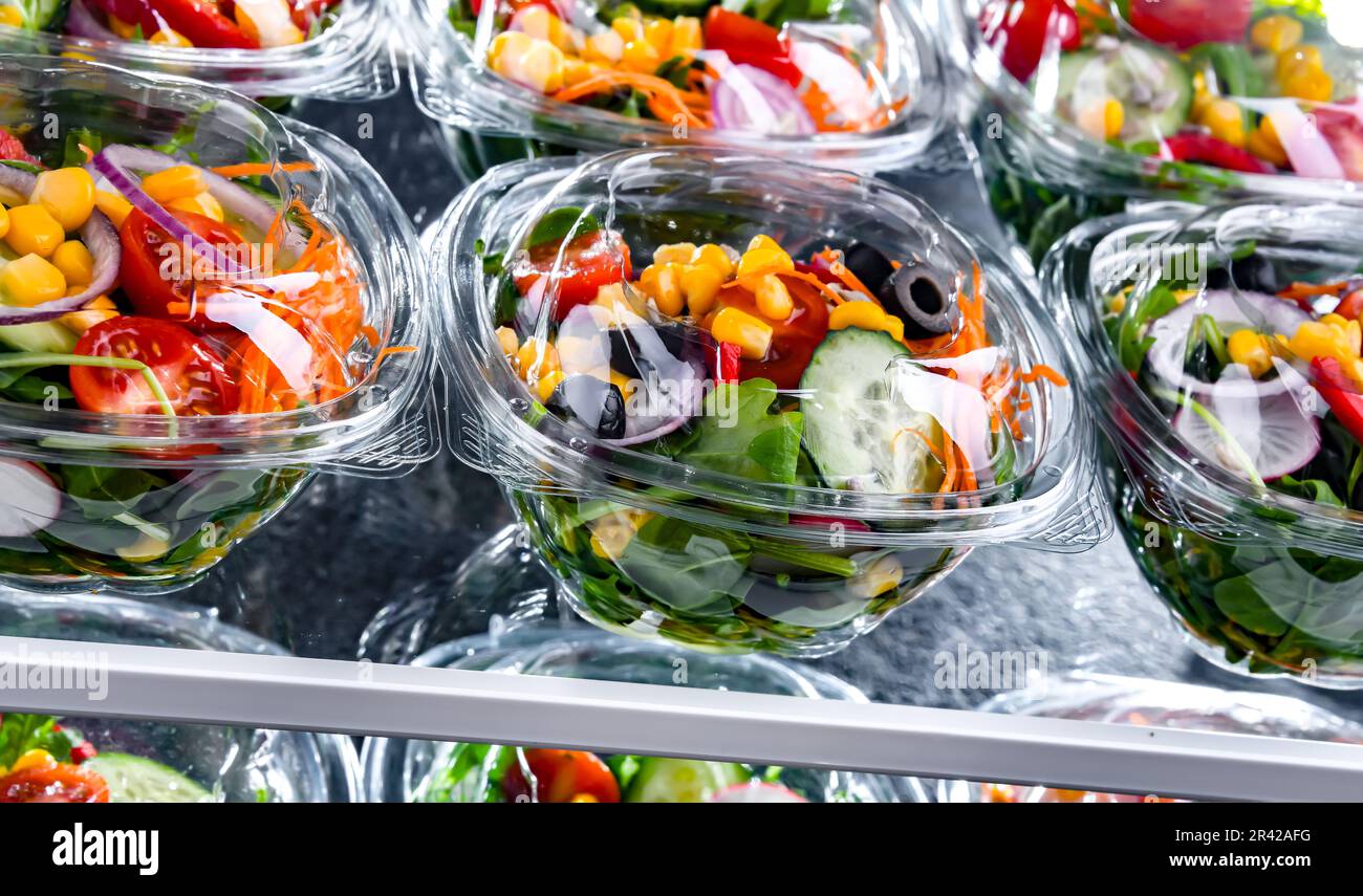 Plastic boxes with pre-packaged vegetable salads Stock Photo - Alamy