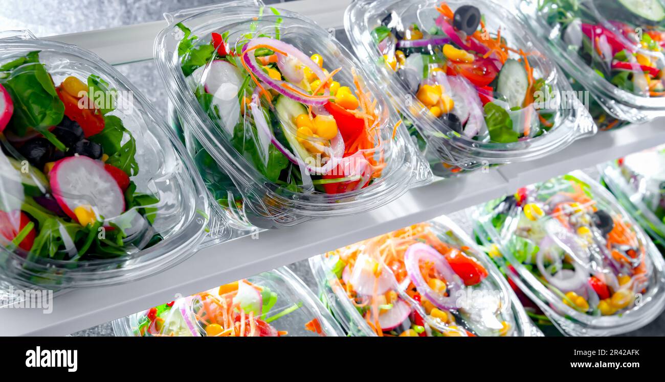 Plastic boxes with pre-packaged vegetable salads Stock Photo - Alamy