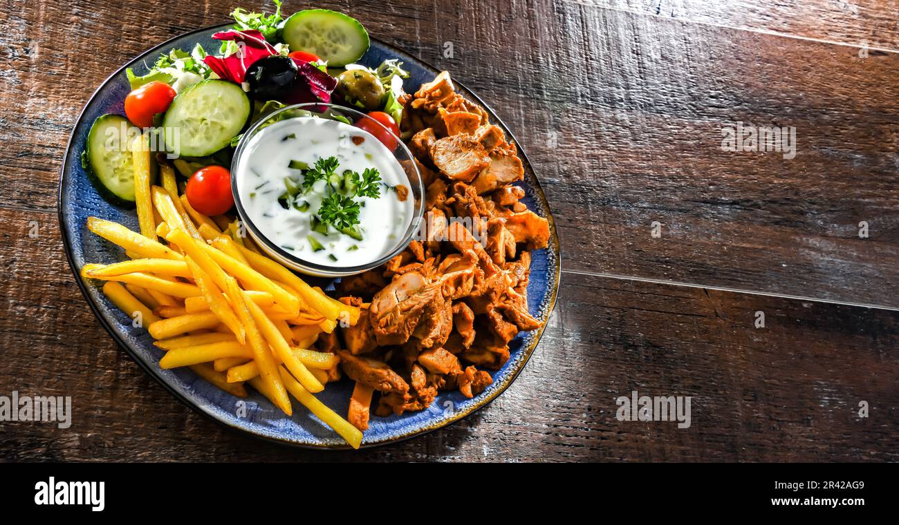 Kebab served with french fries Stock Photo - Alamy