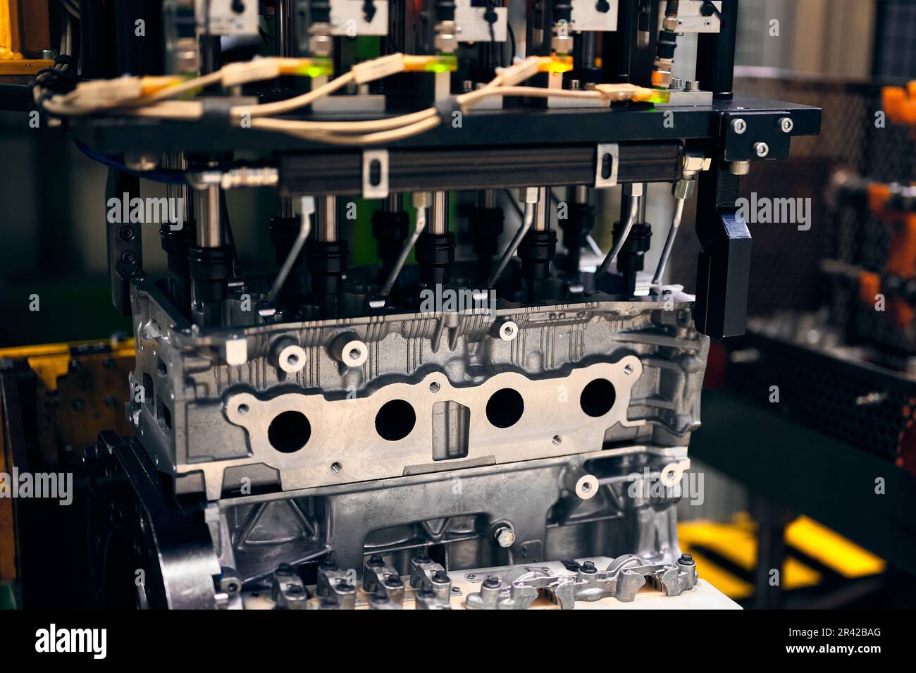 Process of screwing threaded studs into cylinder block case Stock Photo ...