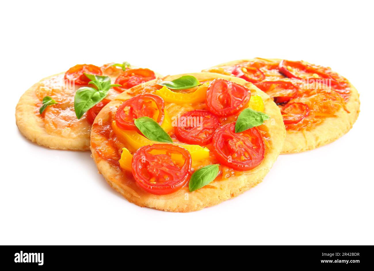 Different tasty mini pizzas on white background Stock Photo - Alamy