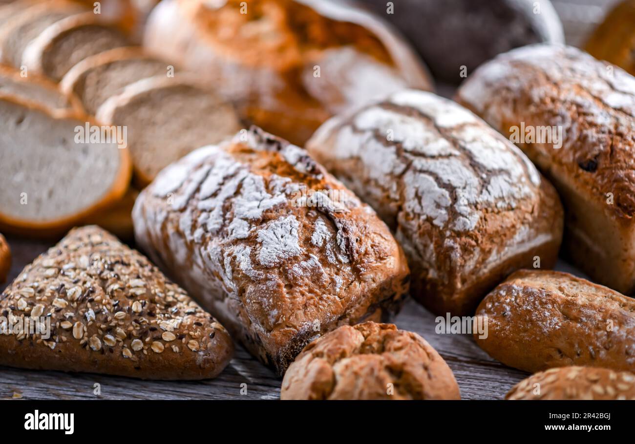 Assorted bakery products including loaves of bread and rolls Stock ...
