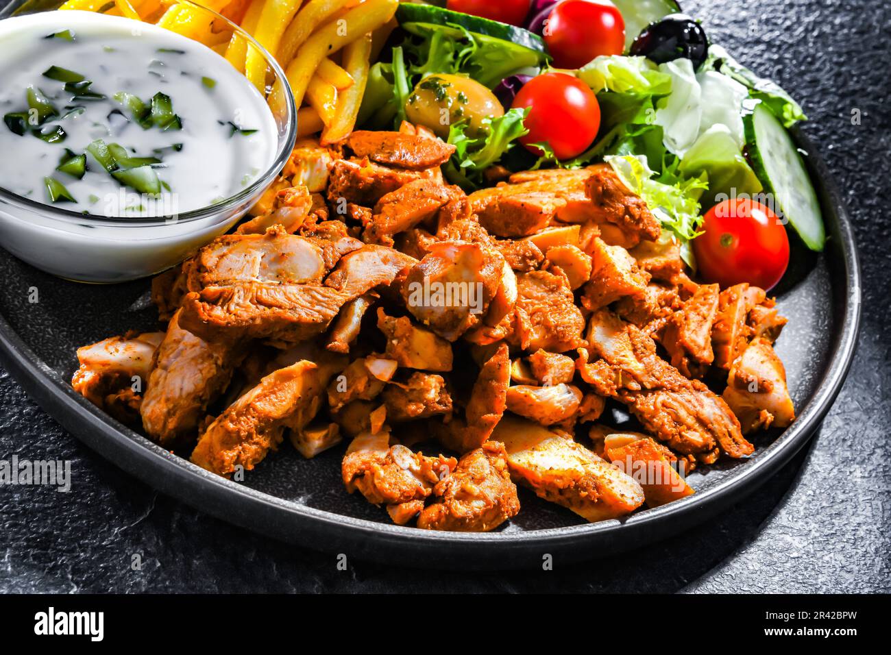 Kebab served with french fries Stock Photo - Alamy