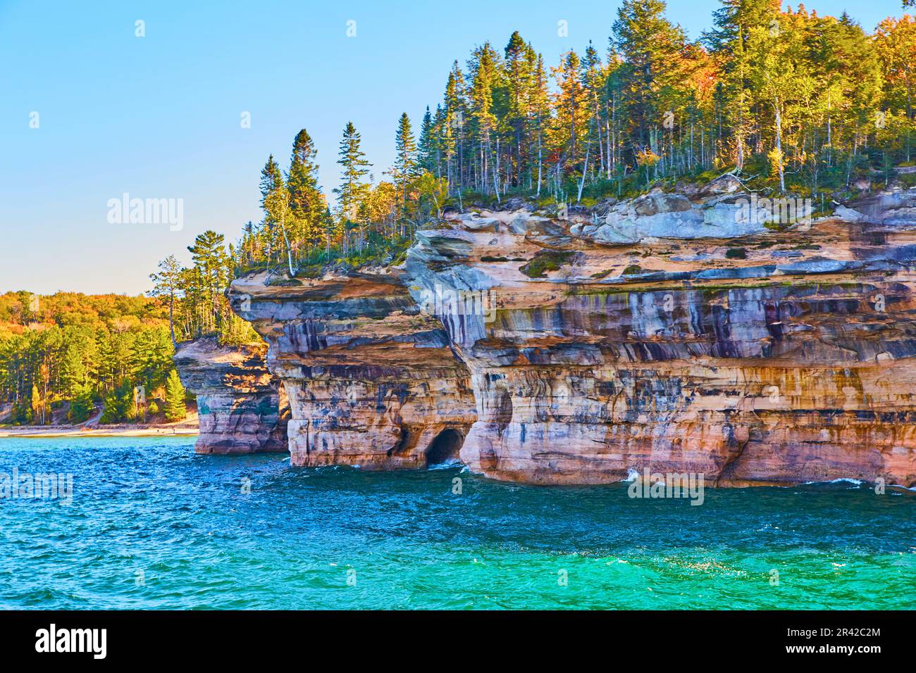 Extremely colorful cliff face walls at pictured rocks with turquoise ...