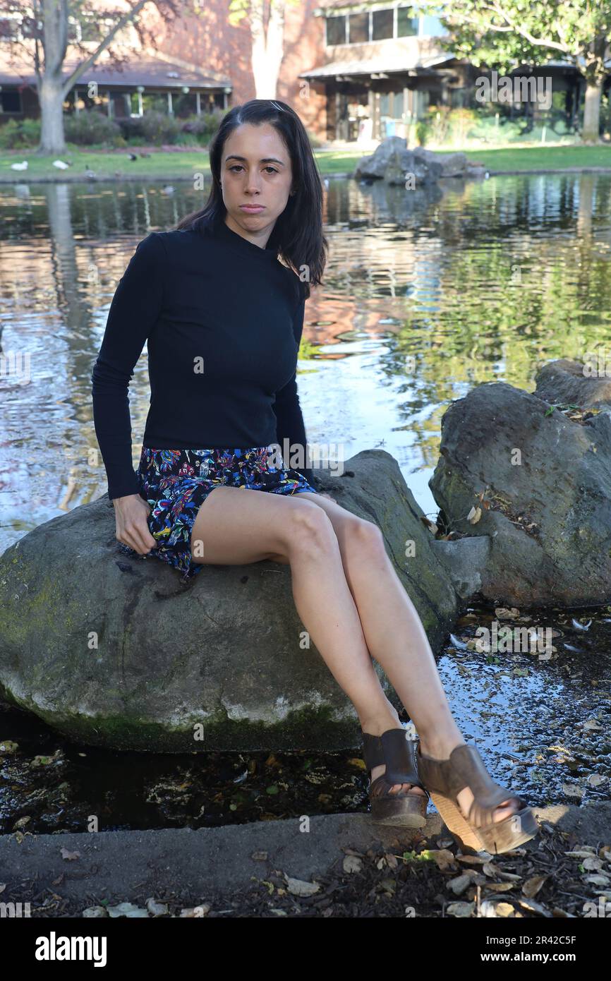 Photoshoot of a Hispanic model in a park Stock Photo - Alamy
