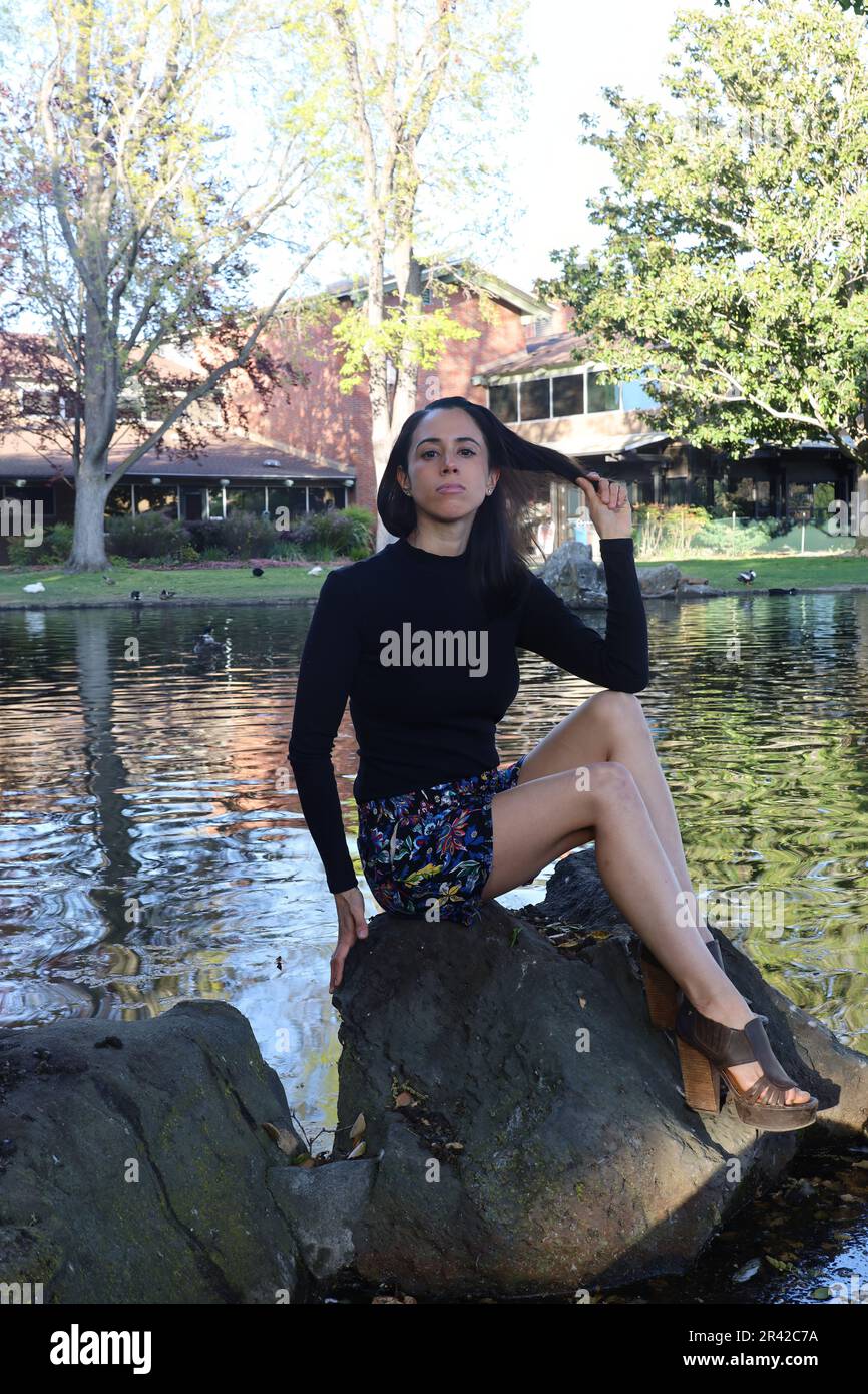 Photoshoot of a Hispanic model in a park Stock Photo - Alamy