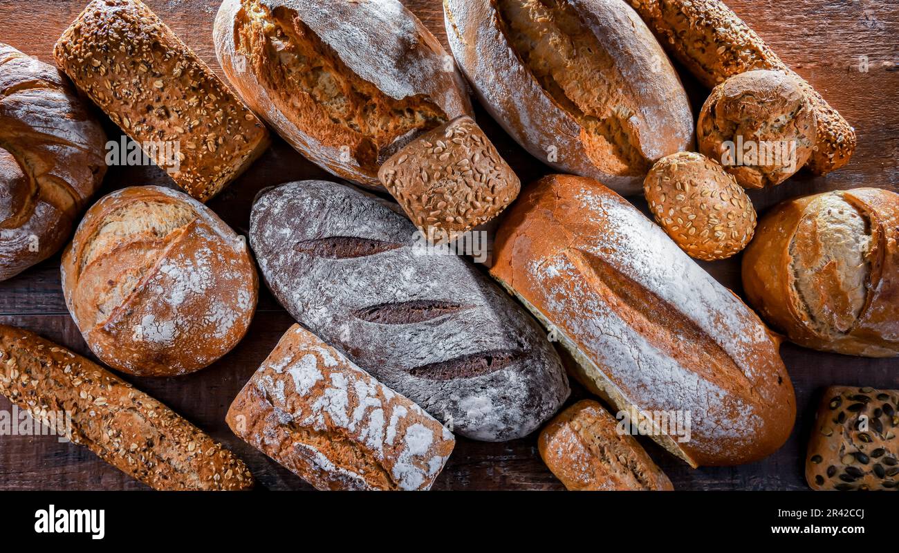 Assorted bakery products including loaves of bread and rolls Stock ...