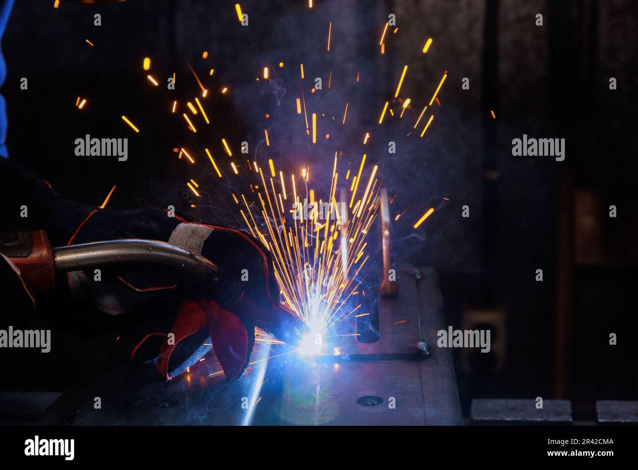 During welding process at this workplace, sparks are lighting smoke in ...