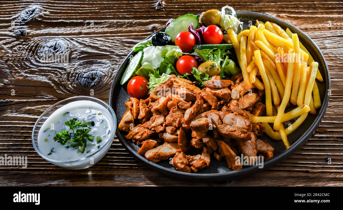 Kebab served with french fries Stock Photo - Alamy