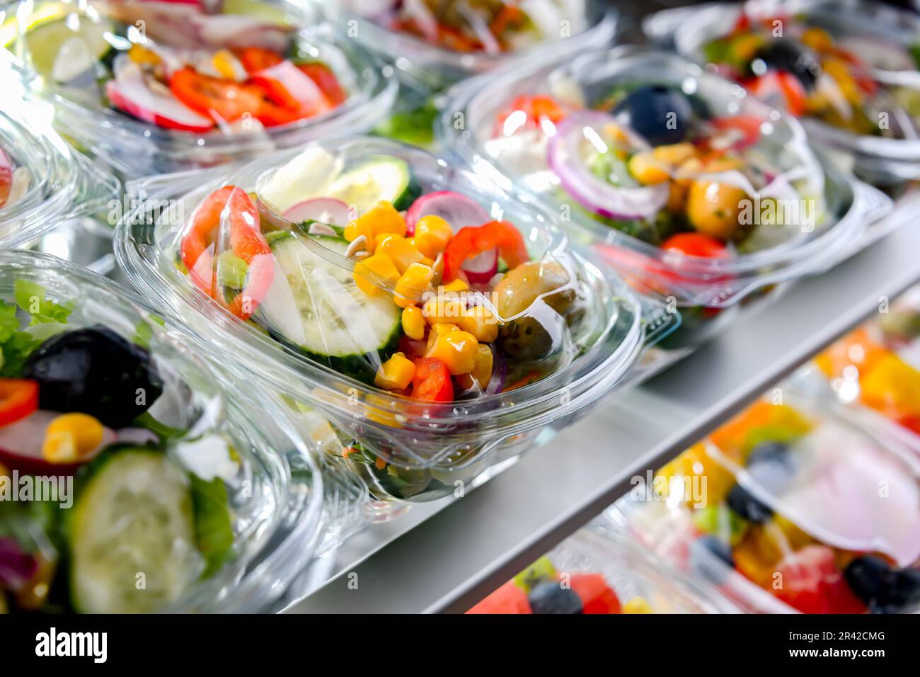 Plastic boxes with pre-packaged vegetable salads Stock Photo - Alamy