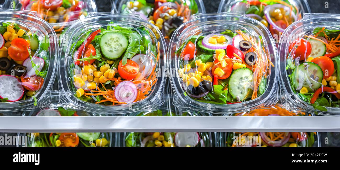 Plastic boxes with pre-packaged vegetable salads Stock Photo - Alamy