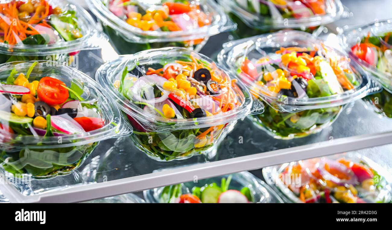 Plastic boxes with pre-packaged vegetable salads Stock Photo - Alamy