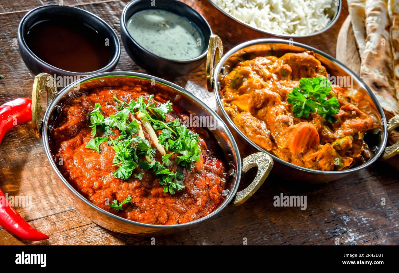 Hot madras paneer and vegetable masala with basmati rice served in ...