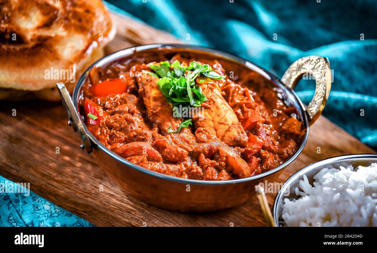 Butter chicken with rice and naan flatbread served in original indian ...