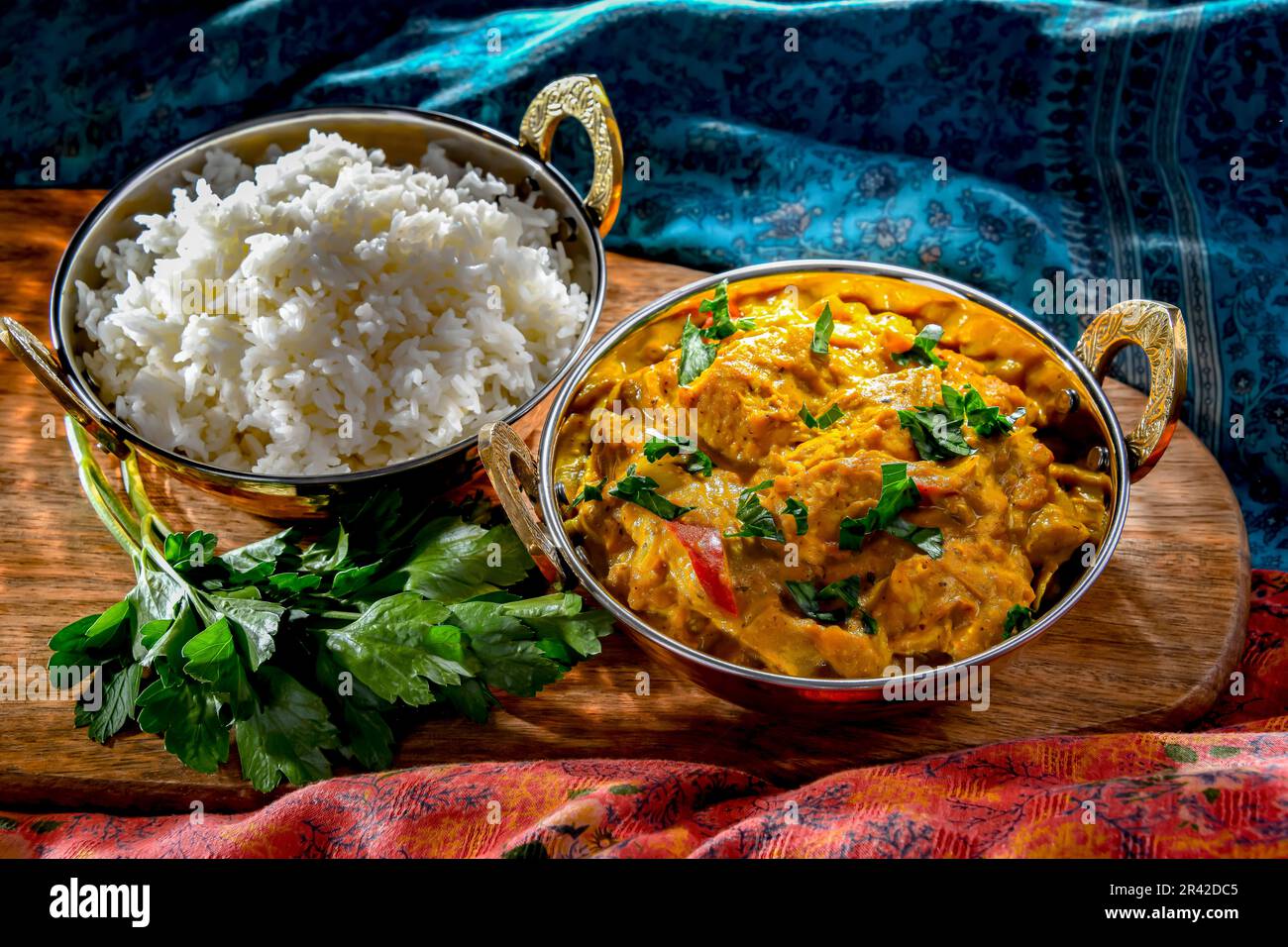 Curry chicken with rice served in original indian karahi pots Stock ...
