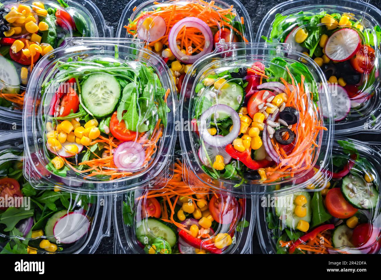 Plastic boxes with pre-packaged vegetable salads Stock Photo - Alamy