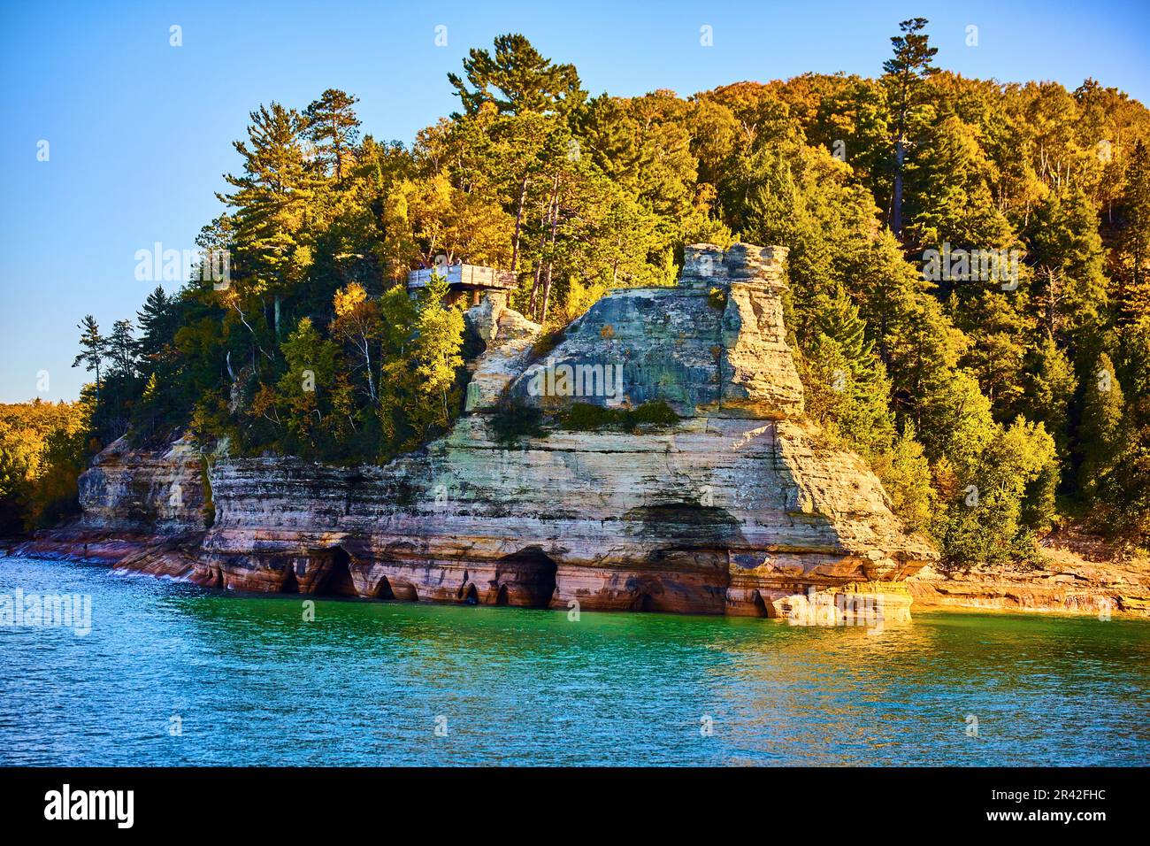 Castle rock Pictured Rocks with caverns in water of Lake Superior ...