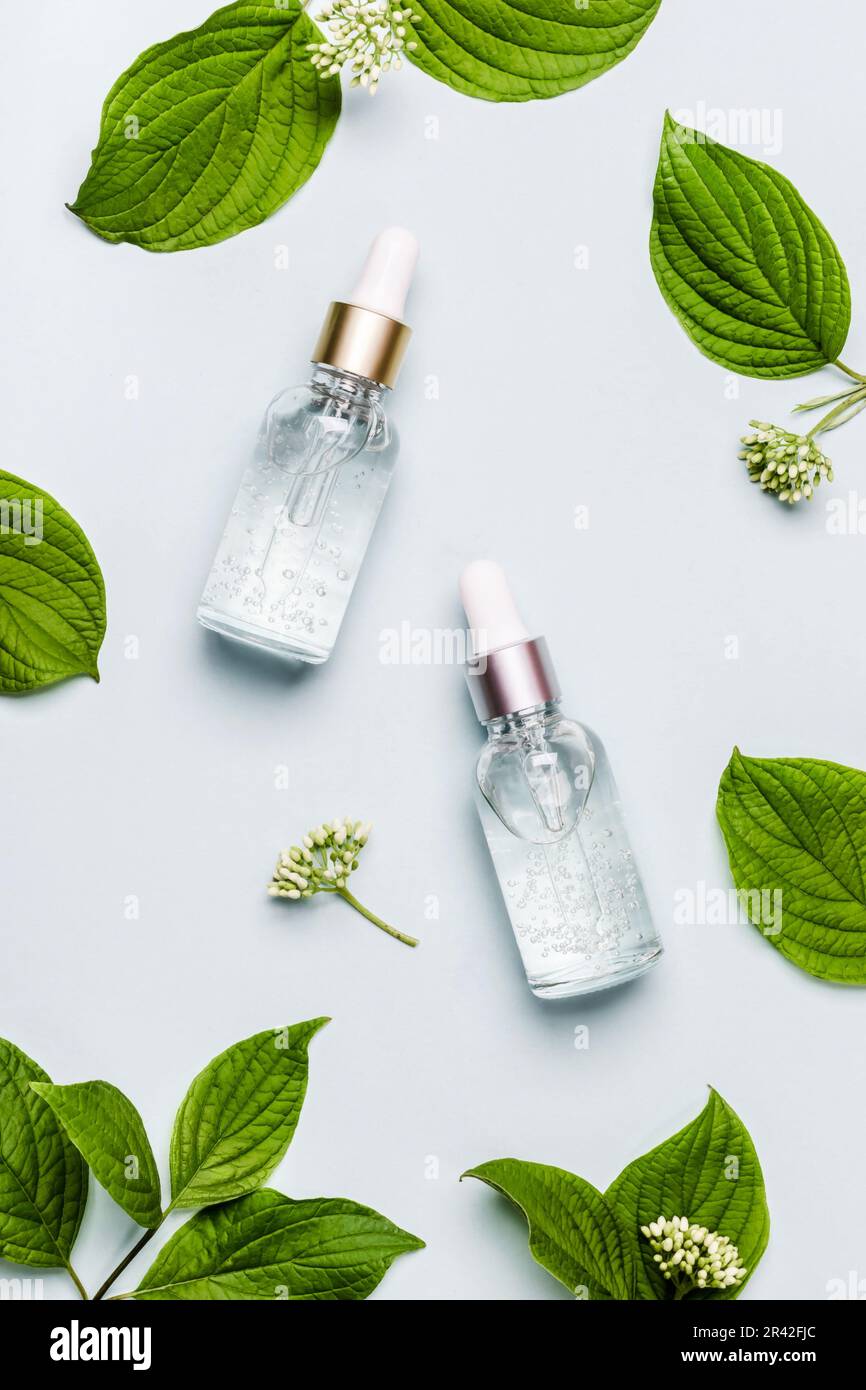 Serum or Liquid Collagen Bottles on pastel blue background. Anti age ...