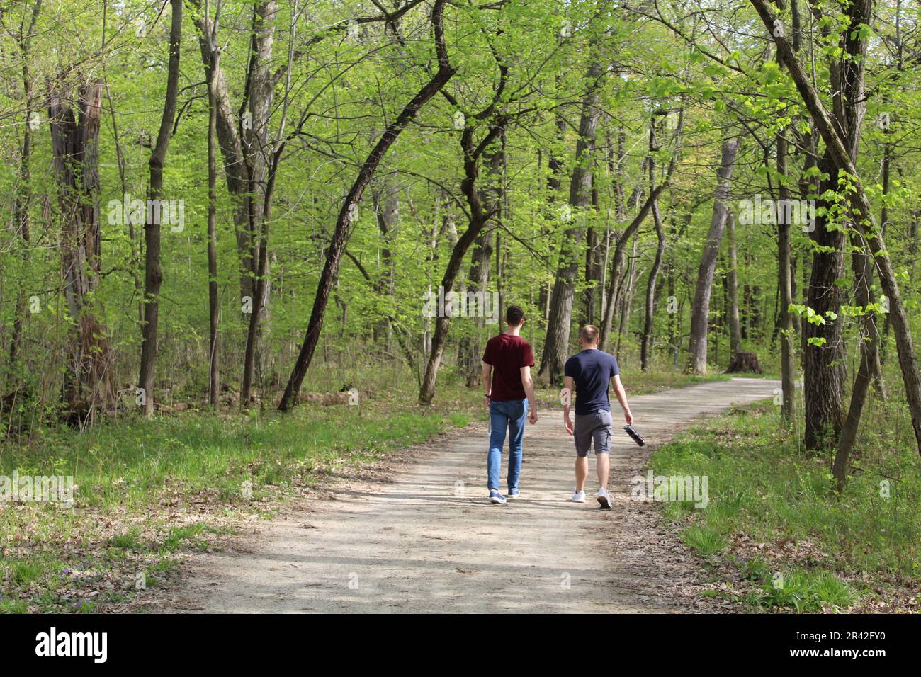 Two men walking together hi-res stock photography and images - Alamy