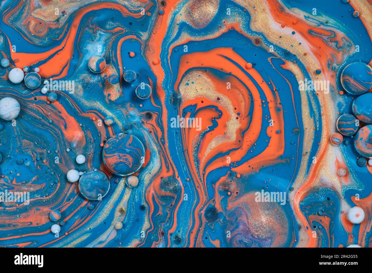 Oil spill of orange blue gold and white in abstract painting asset ...