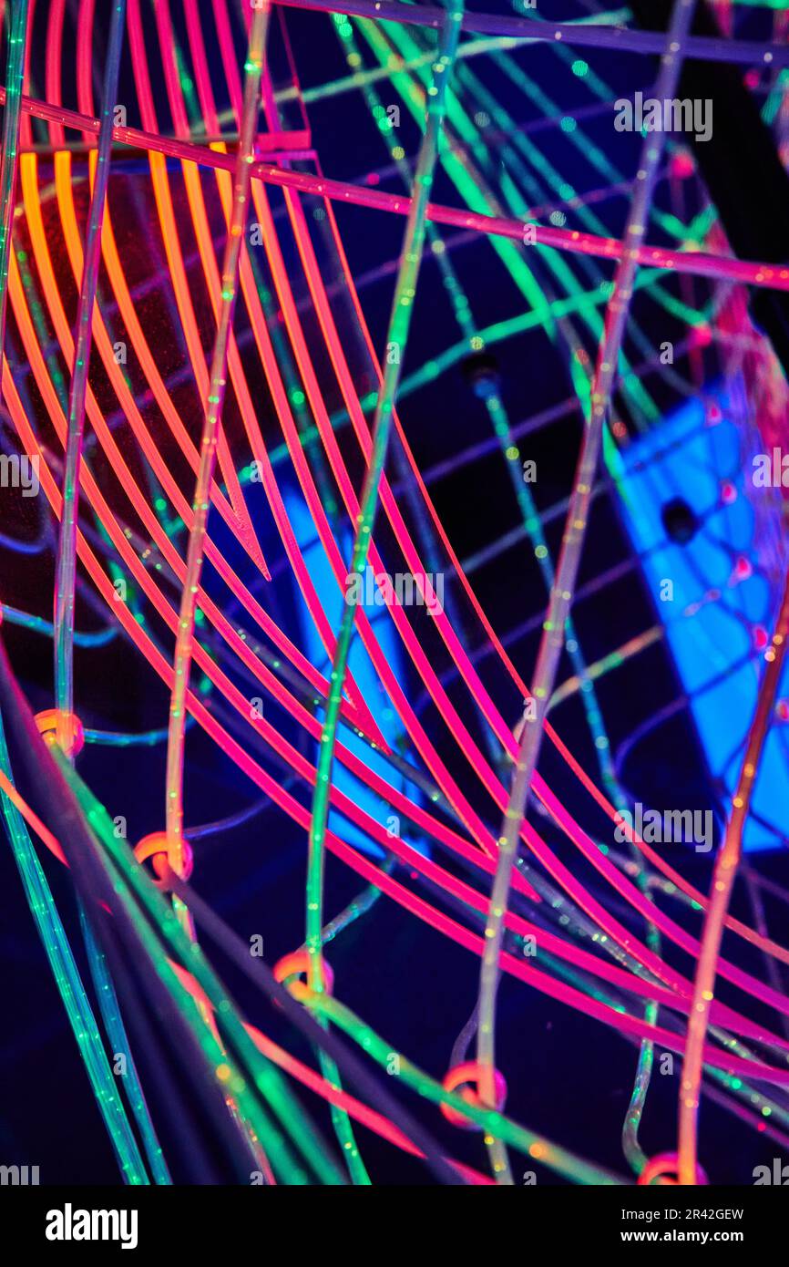Asset of a web of wires with pink and orange LED neon lights with ...