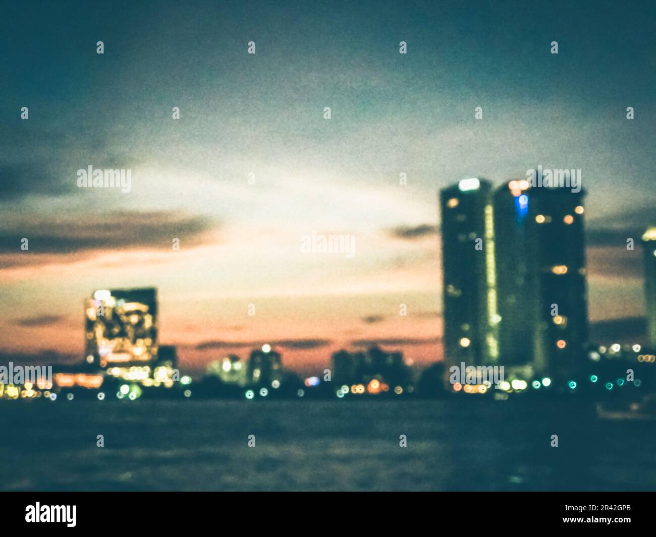 Blur of modern city building at night with reflection in water Stock ...