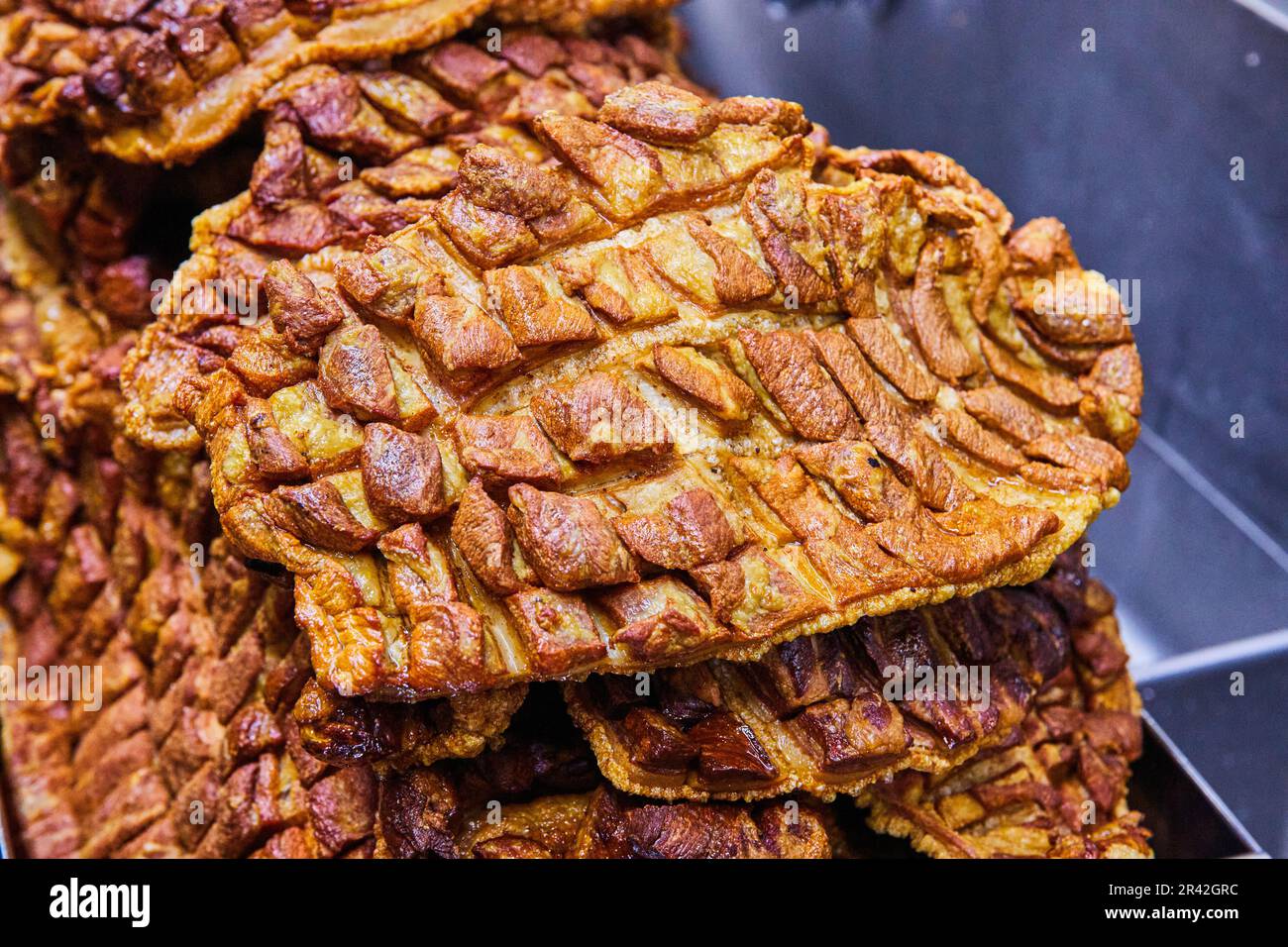 Meat on chicharrones piled high asset Stock Photo - Alamy