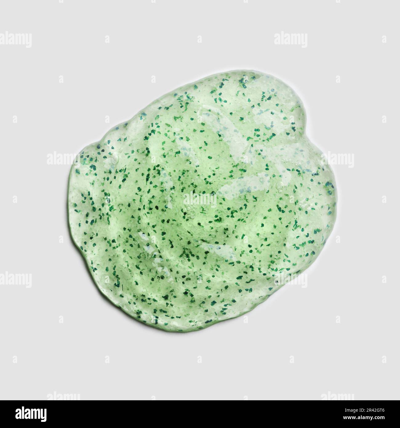 Green Gel exfoliating mask peeling with natural particles smear on gray ...