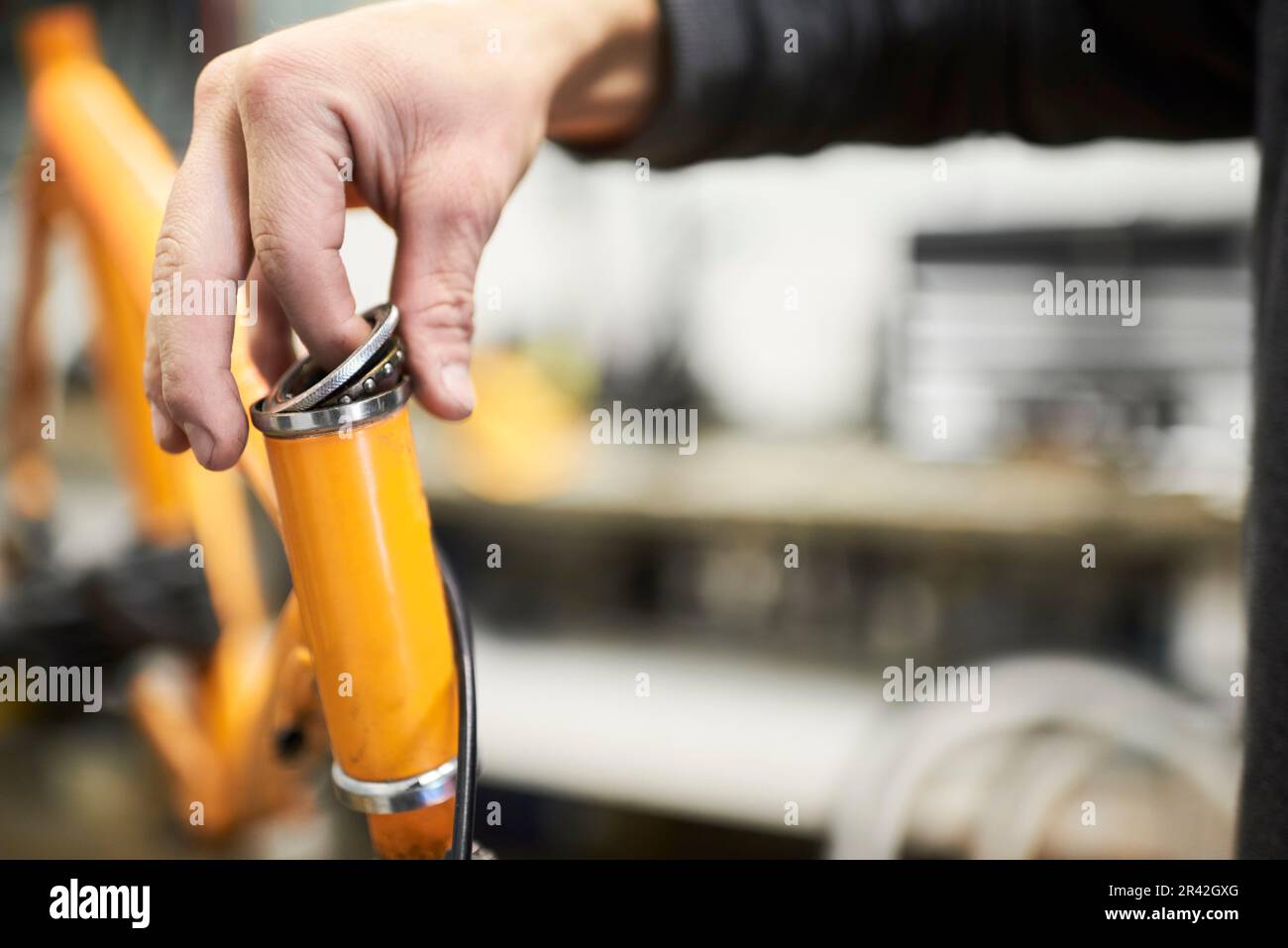 Maintenance of a bicycle: hands of an unrecognizable person ...