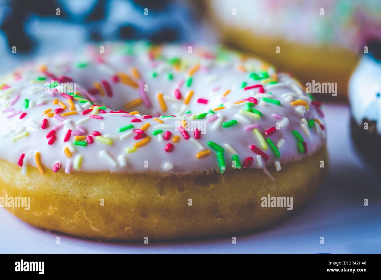 Ring donut with white glaze Stock Photo - Alamy