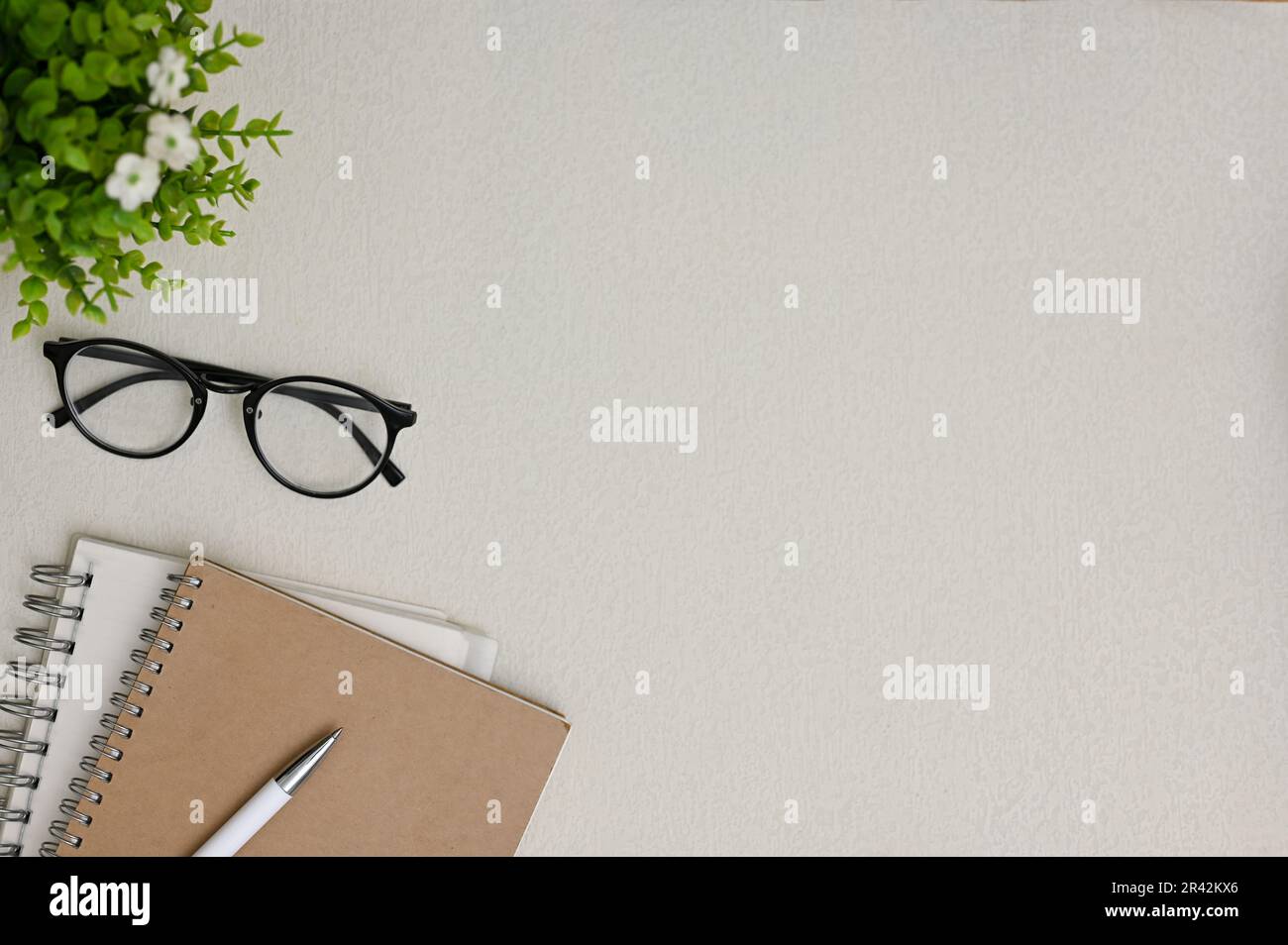 Top view of a grey workspace background with copy space for displaying ...