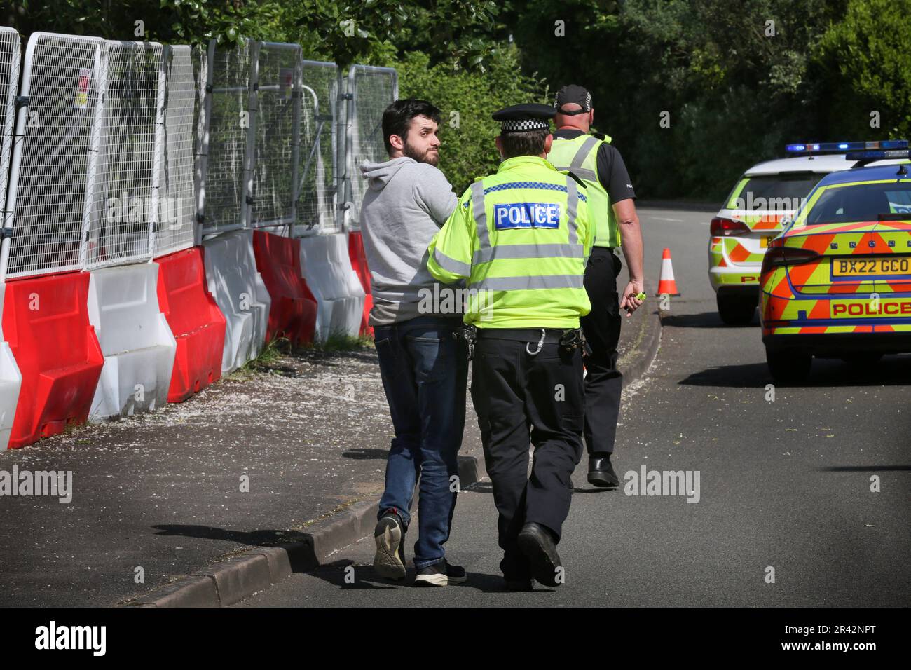 An activist from Palestine Action is arrested after a gate blocking ...