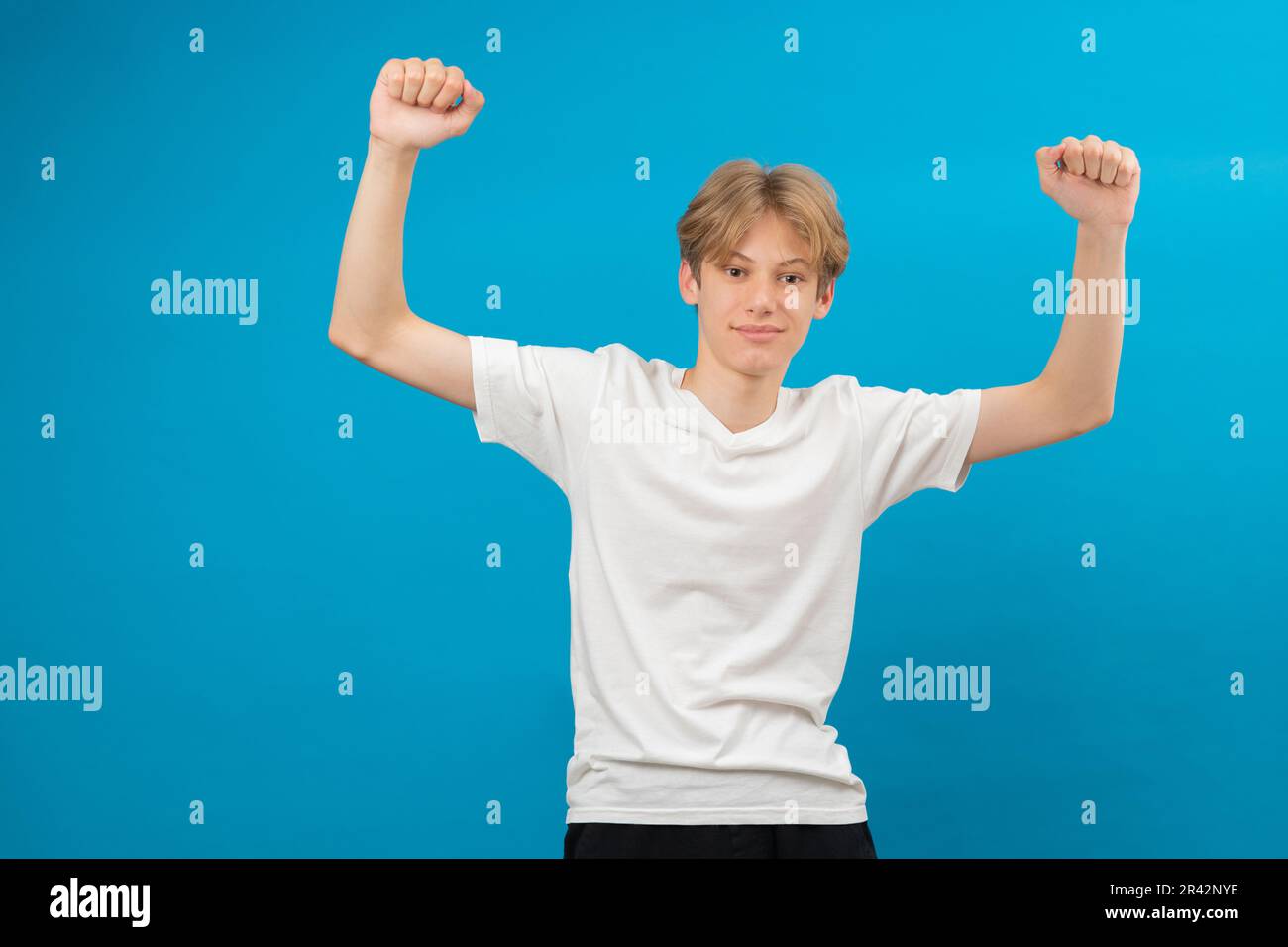 Extremely excited overjoyed teen boy shouting making yes gesture ...