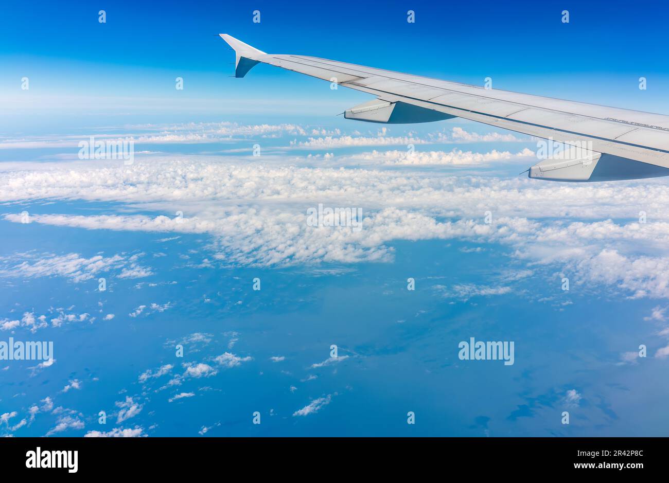 View from the airplane window at a beautiful cloudy sky and the ...