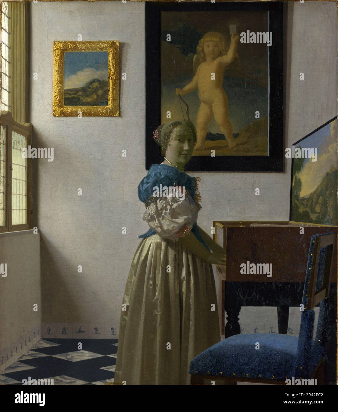 A Young Woman standing at a Virginal painted by the Dutch Golden Age painter Johannes Vermeer in ...